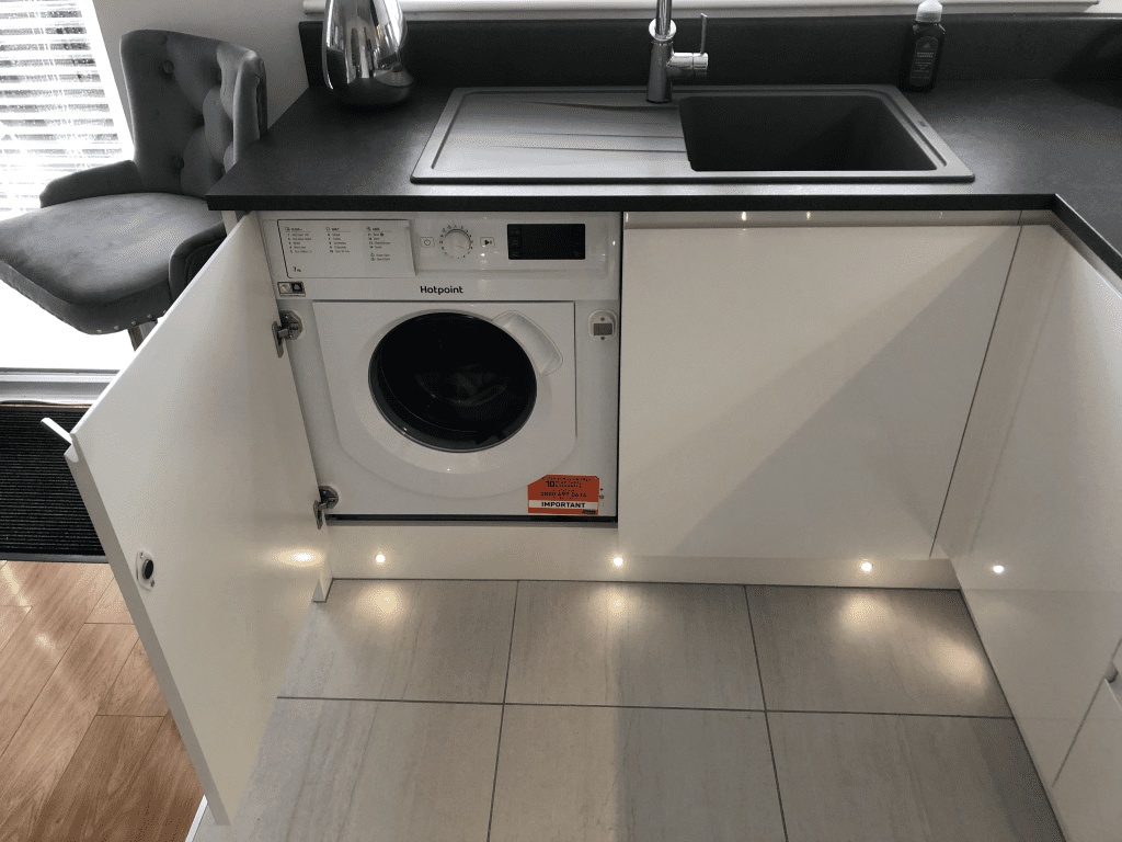 Minimalist Handle-less Kitchen Design In Gloss White Finish